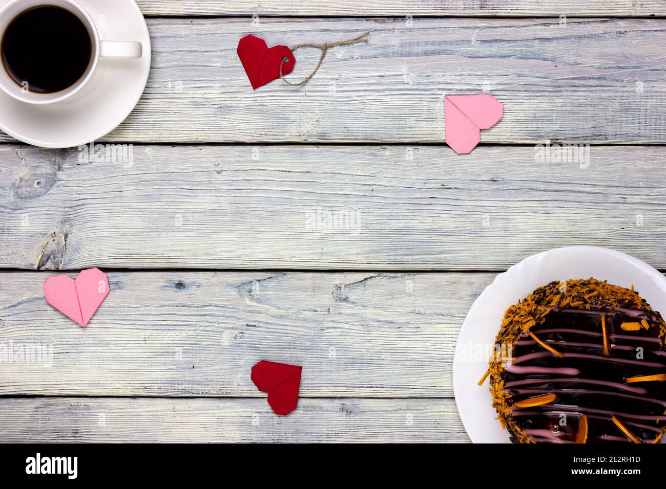 Romantic Flat Lay. Chocolate cake, a cup of coffee and paper hearts on ...
