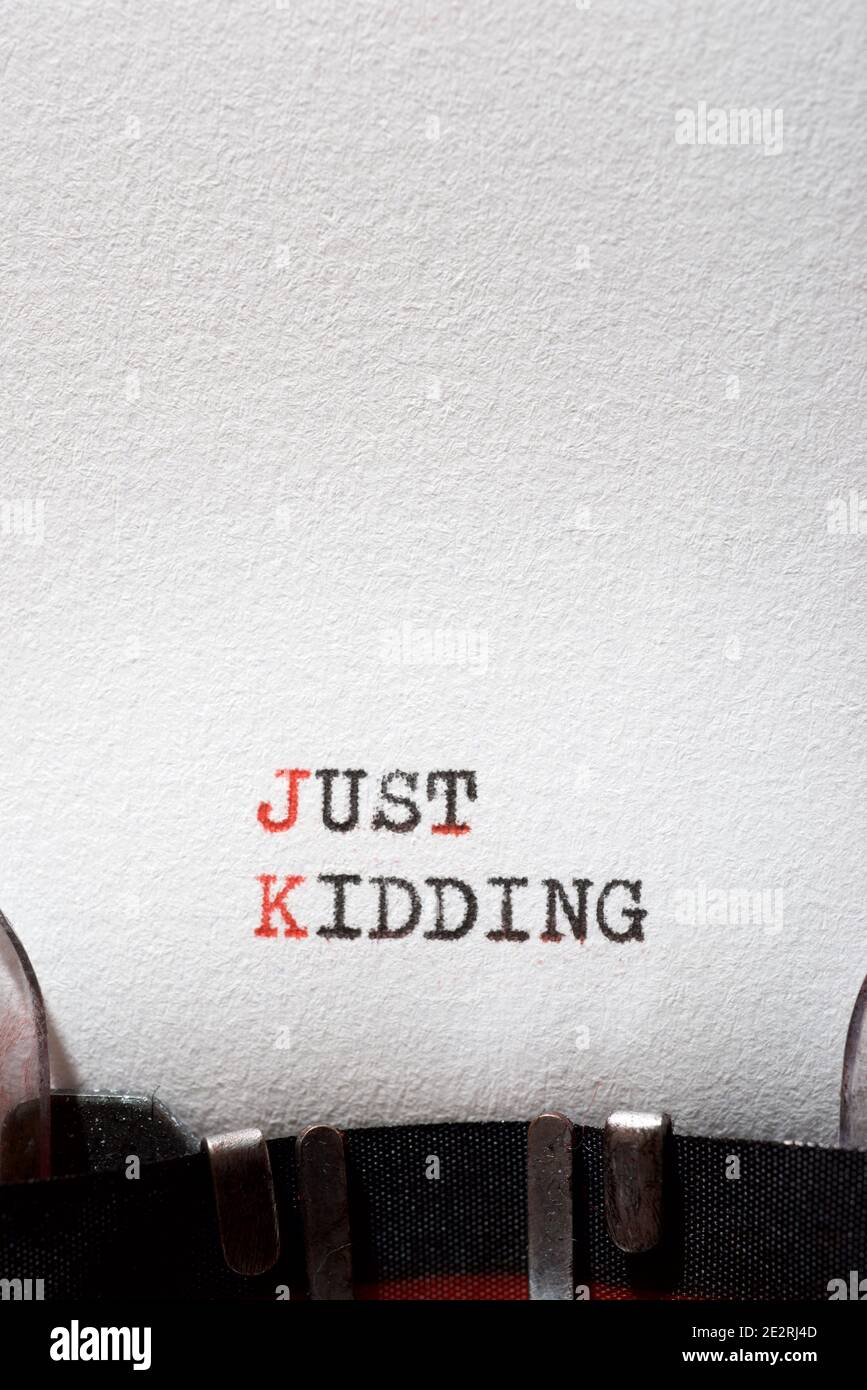 Just kidding phrase written with a typewriter Stock Photo - Alamy