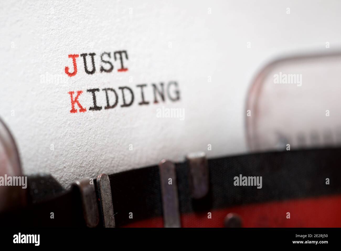 Just kidding phrase written with a typewriter Stock Photo - Alamy
