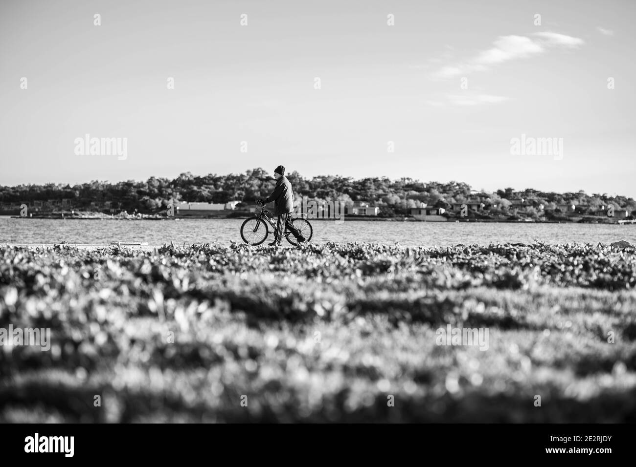 A man walks with his bicycle at Glyfada ,Greece Stock Photo - Alamy
