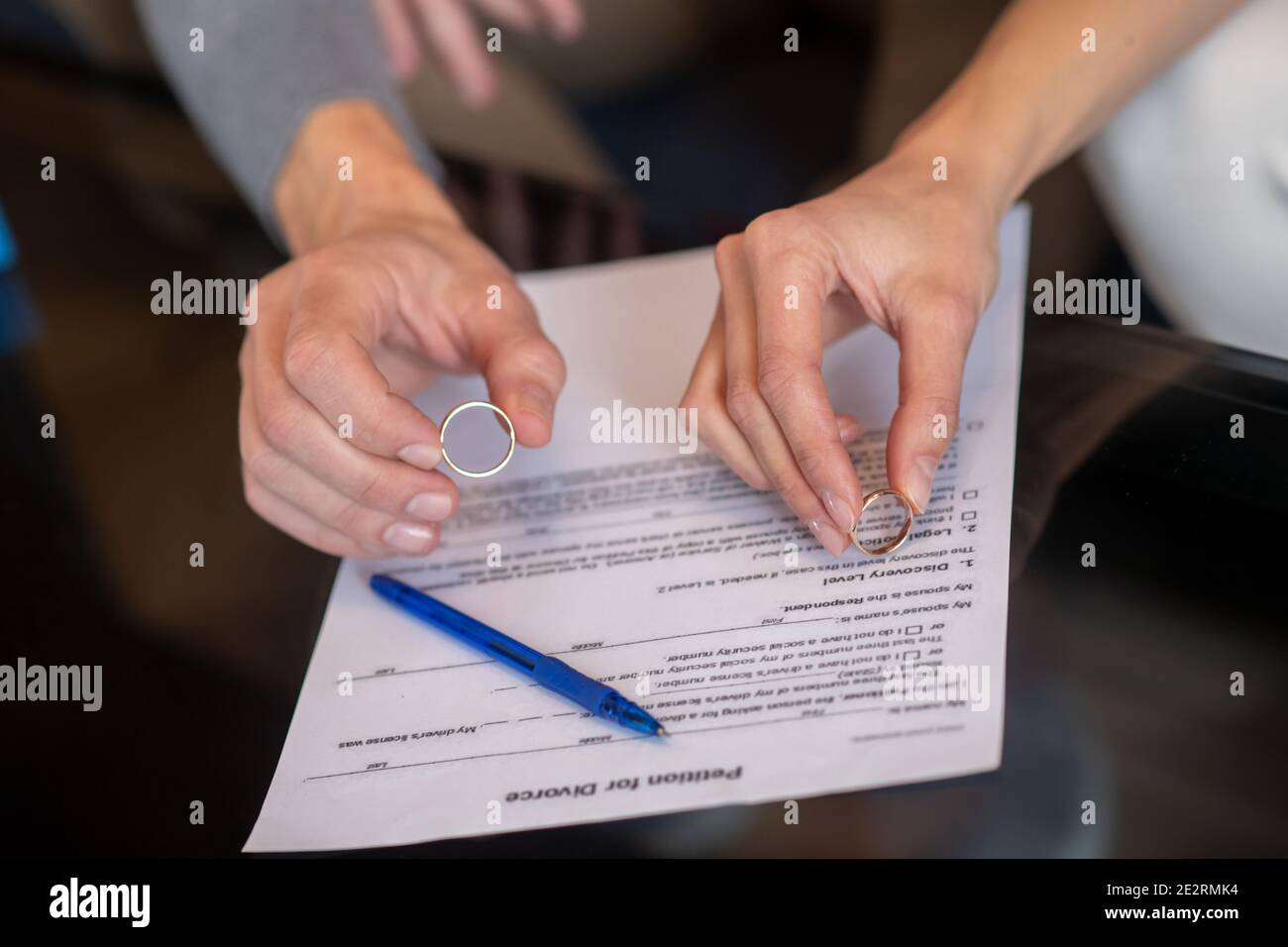Man and woman taking off their wedding rings Stock Photo - Alamy