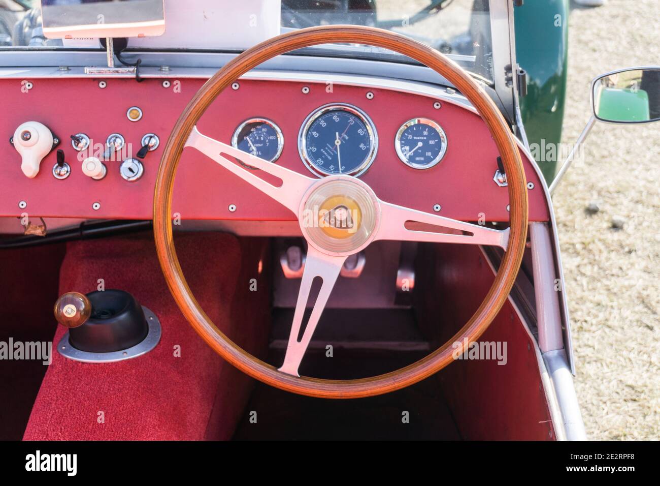 Close up detail of the steering wheel and dashboard of a British racing ...
