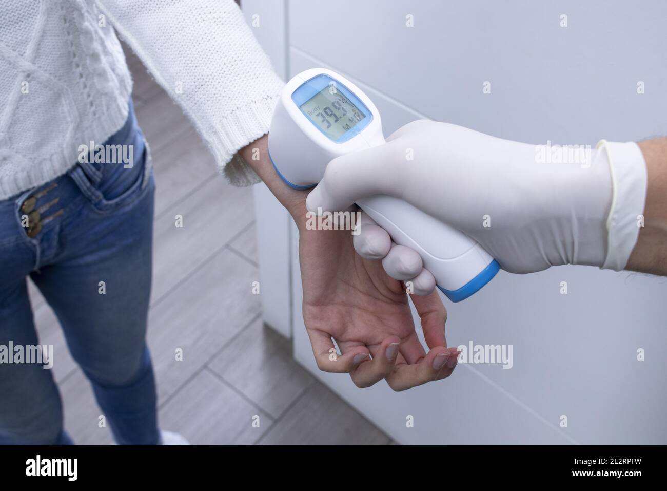 High angle shot of a person checking someone's temperature Stock Photo ...