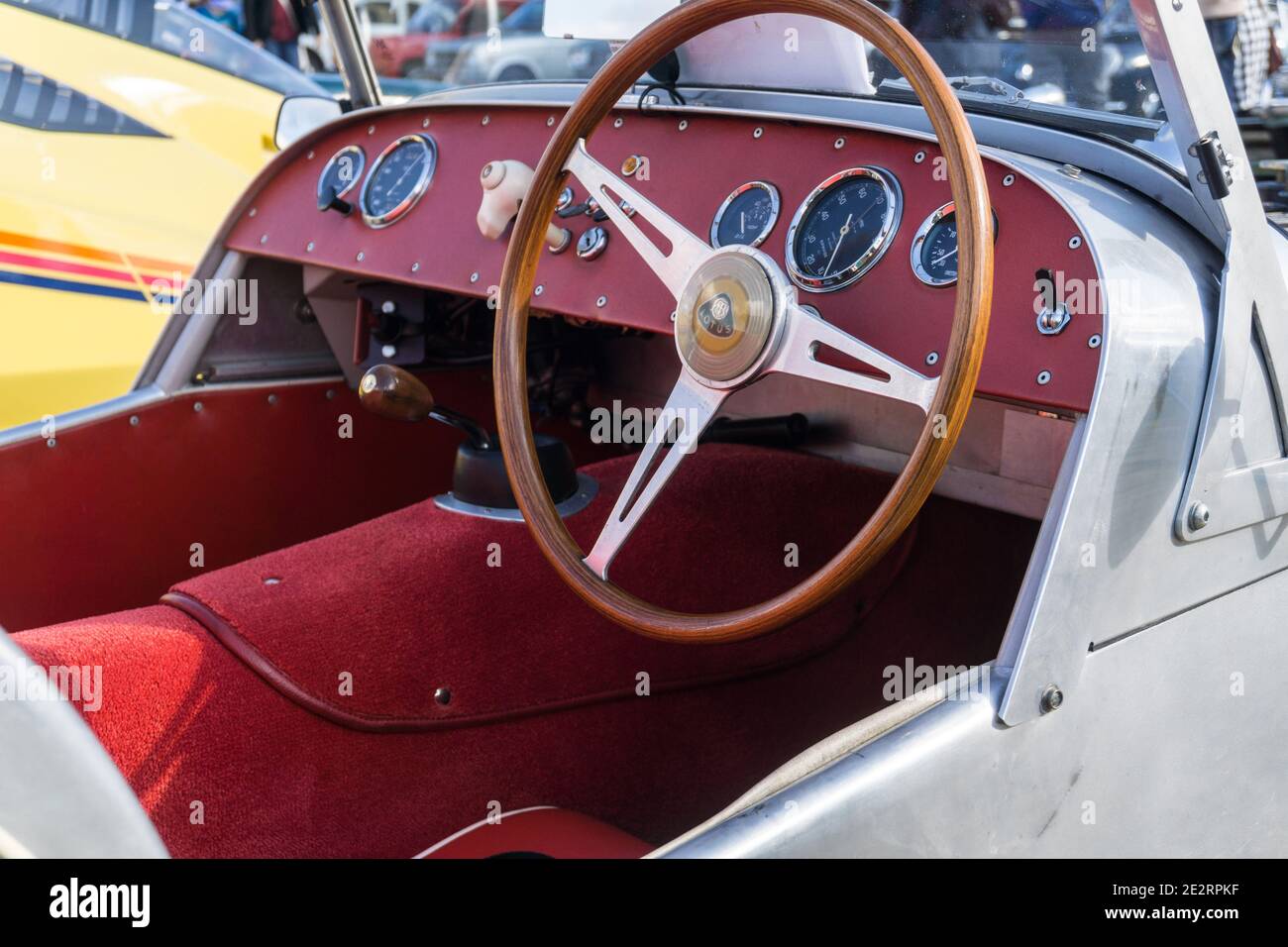 Close up detail of the steering wheel and dashboard of a British racing ...