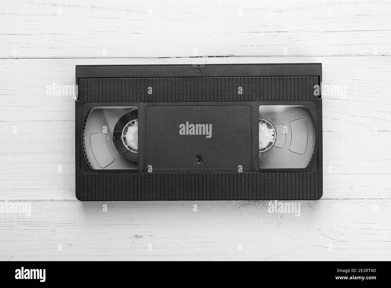 VHS tape from the 80s and 90s on white wood background. Retro media ...