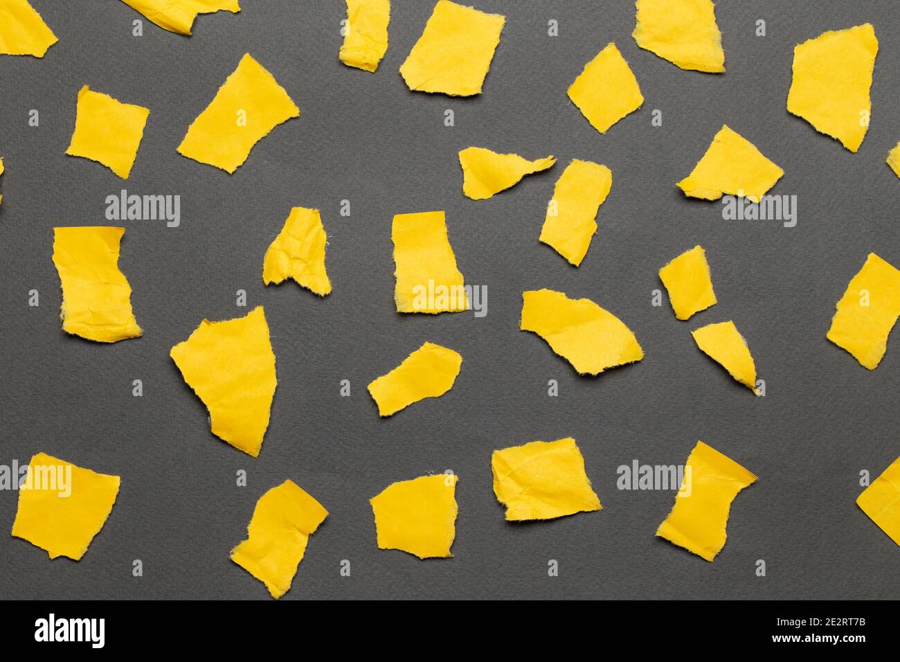 Set of torn paper in yellow on a gray background. Top view Stock Photo ...