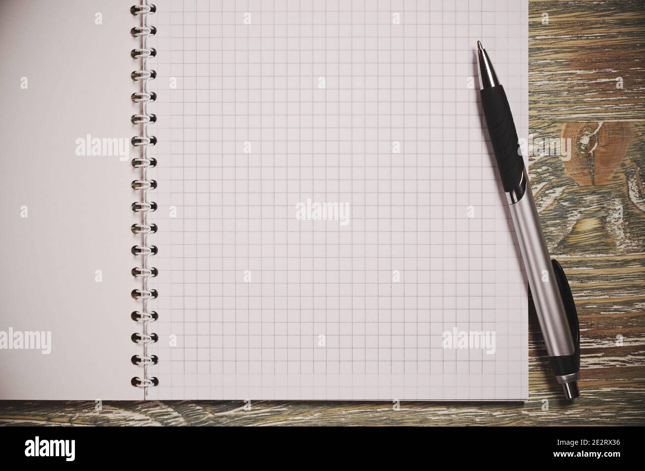 Notepad and pen on wood background, top view. Vintage style Stock Photo ...