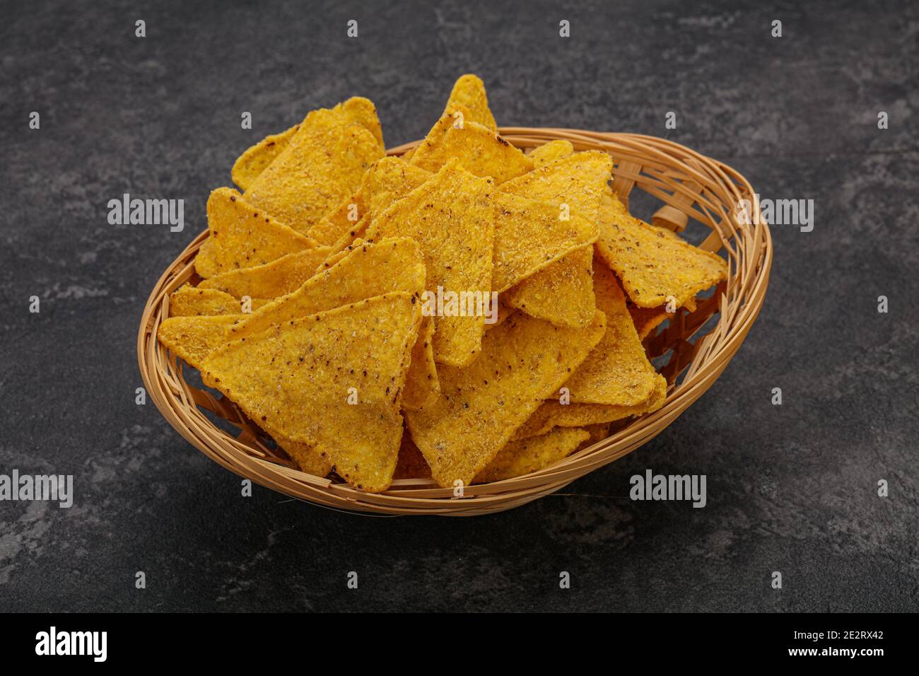 Mexican crunchy corn nachos triangle heap Stock Photo - Alamy