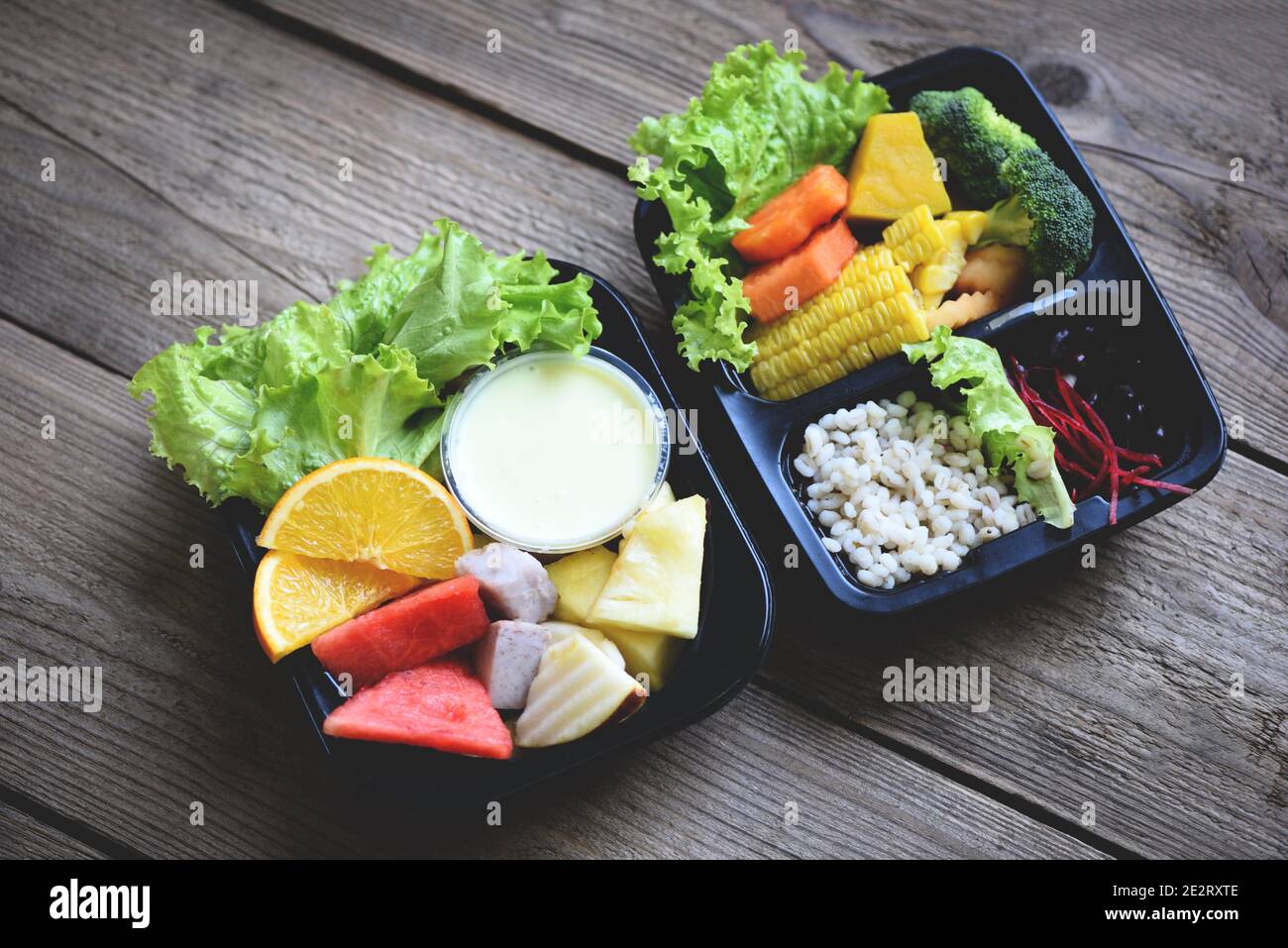 Plastic box food with healthy food box fruit vegetable salad sauce ...