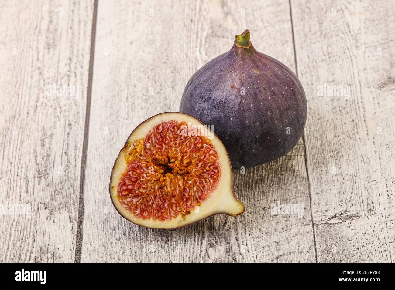 Sweet purple slice of fig fruit Stock Photo - Alamy