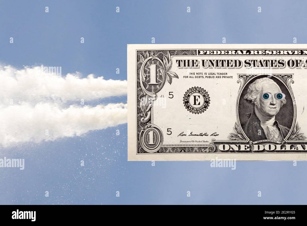 a dollar flying into the sky Stock Photo - Alamy