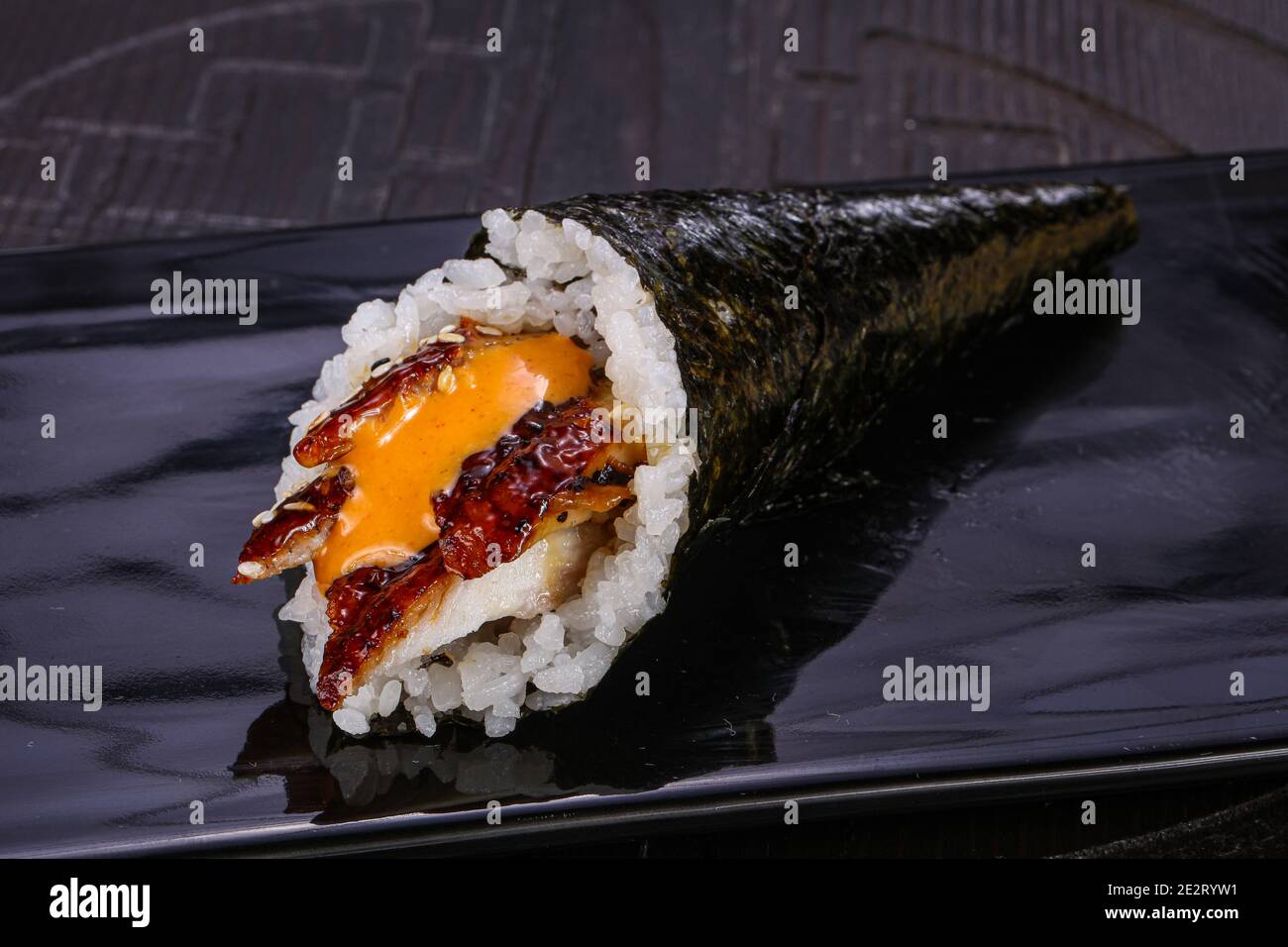 Japanese cuisine - Temaki with eel or handroll Stock Photo - Alamy