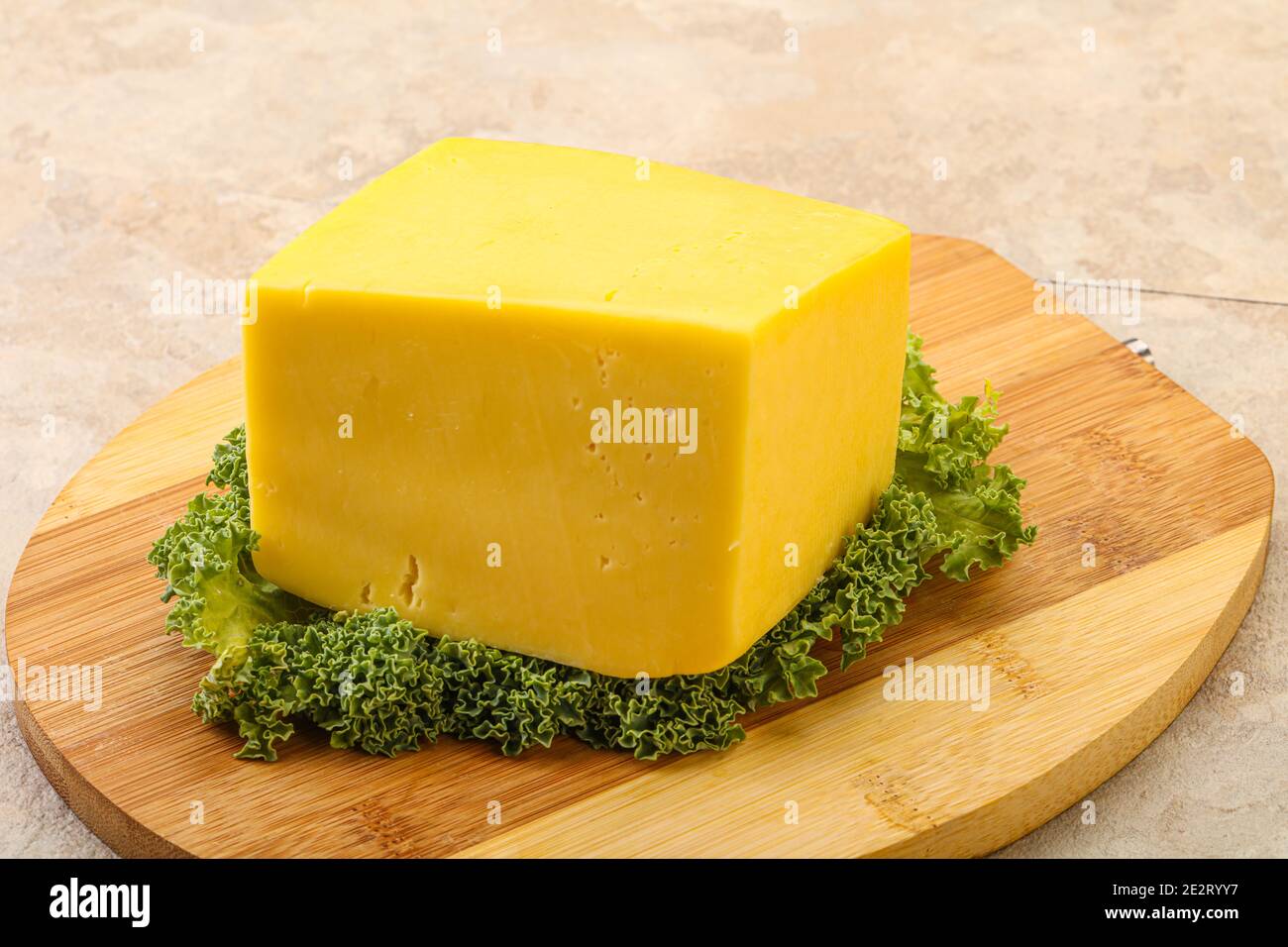Yellow tilsiter cheese dairy product brick Stock Photo - Alamy