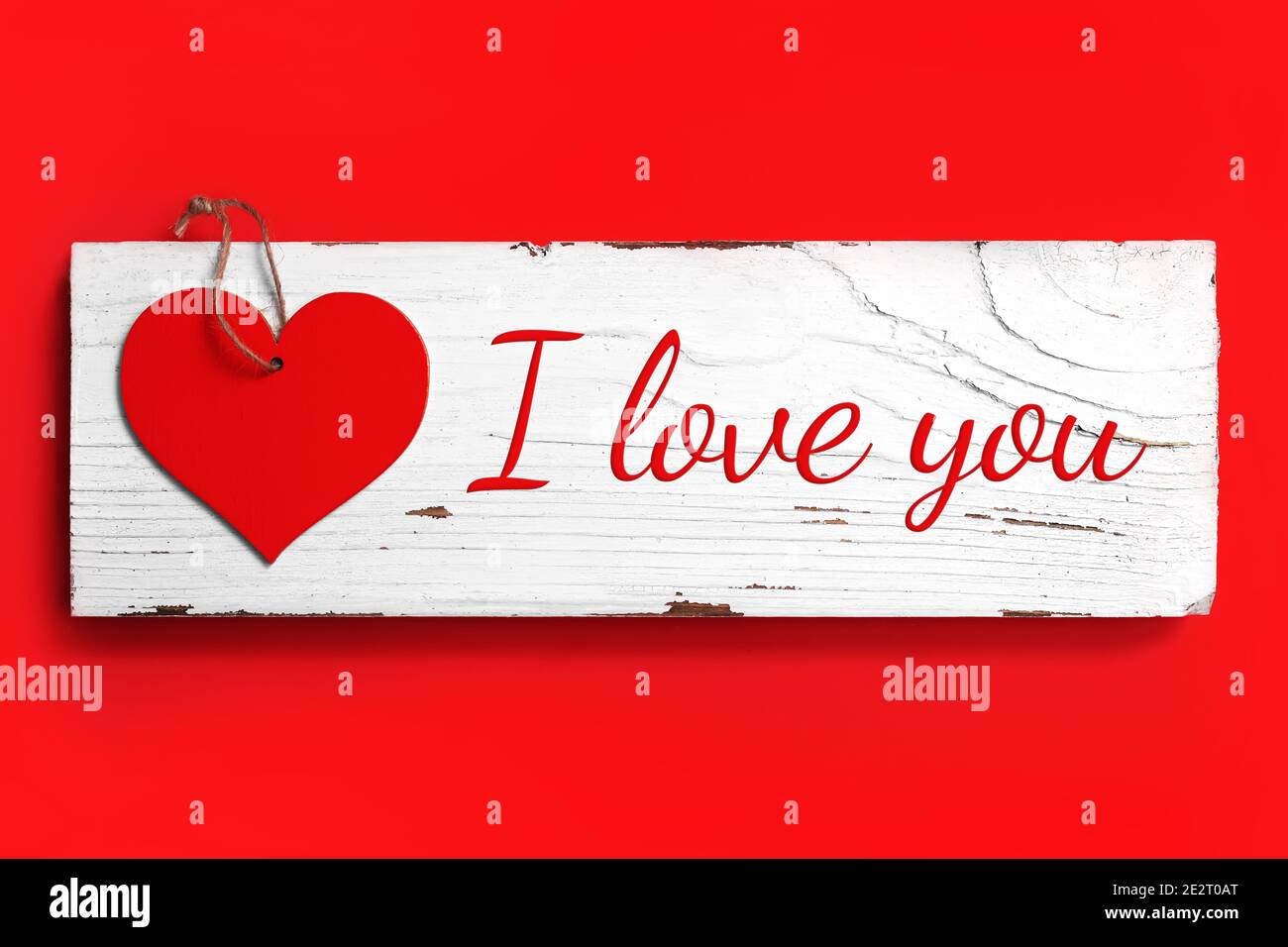 red heart on white wooden and red background with text I love you. top ...