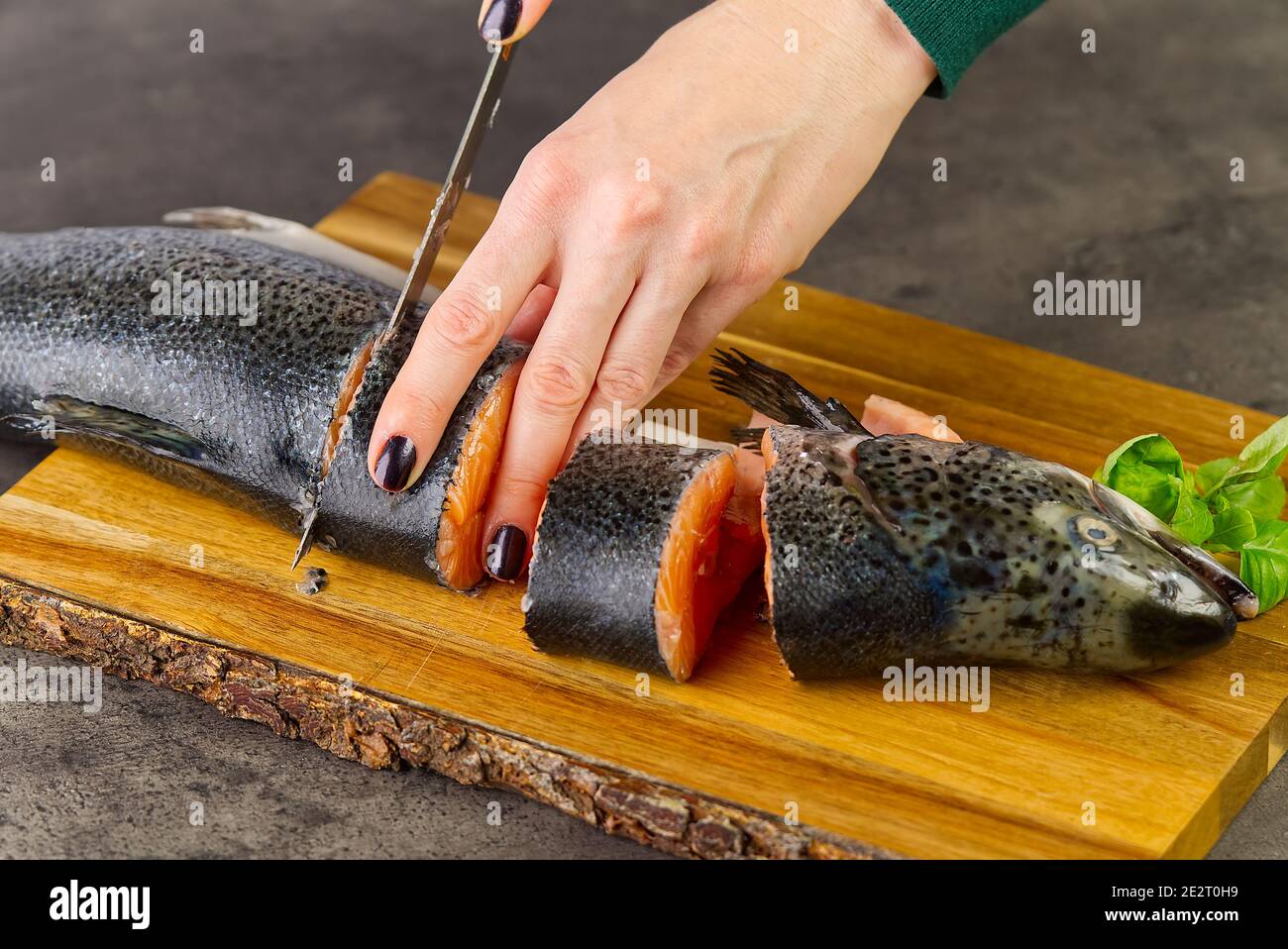 Cutting salmon fresh fish for dinner. diy cooking at home Stock Photo ...