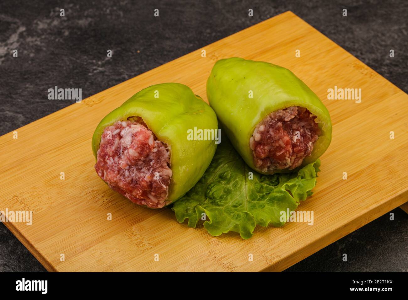 Raw stuffed green bell pepper with meat Stock Photo - Alamy