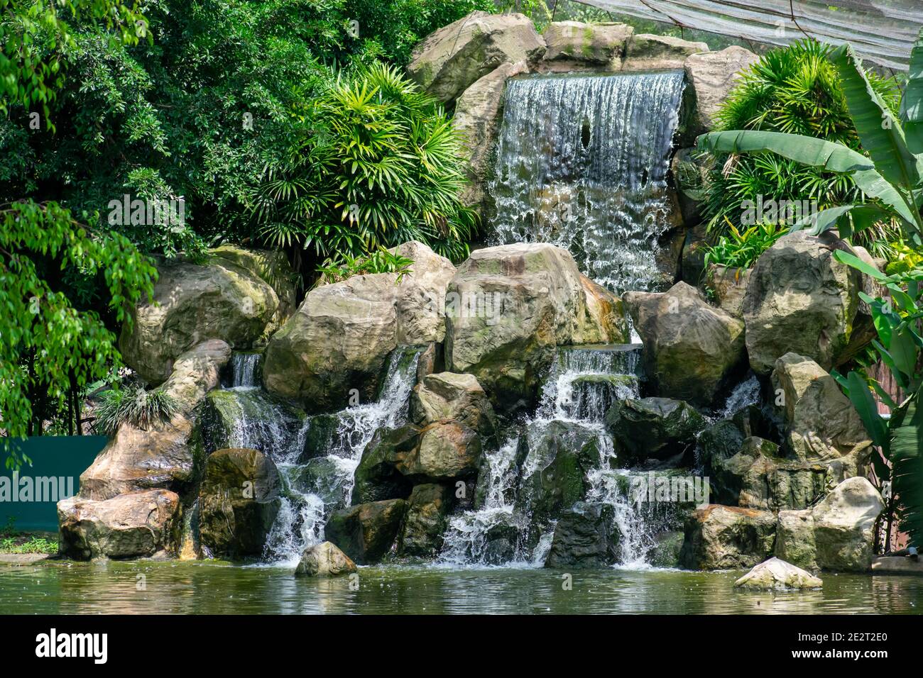 Scenic small waterfall in Kuala Lumpur Bird Park, Malay Stock Photo - Alamy