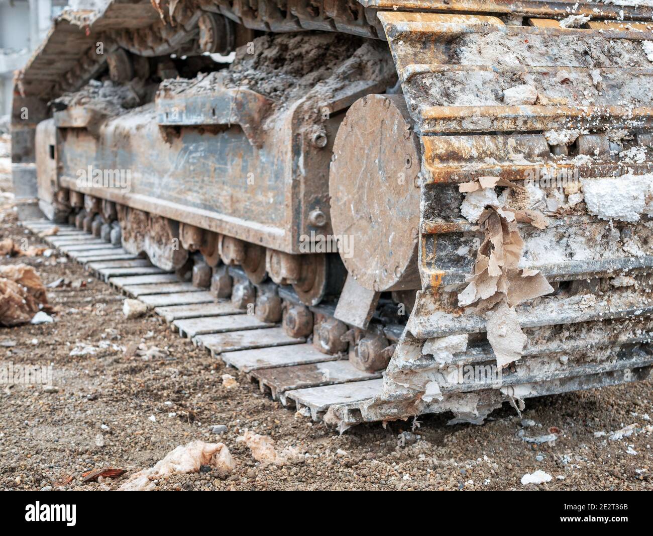 Close up detail with chain tracks of a bulldozer on a demolition site ...