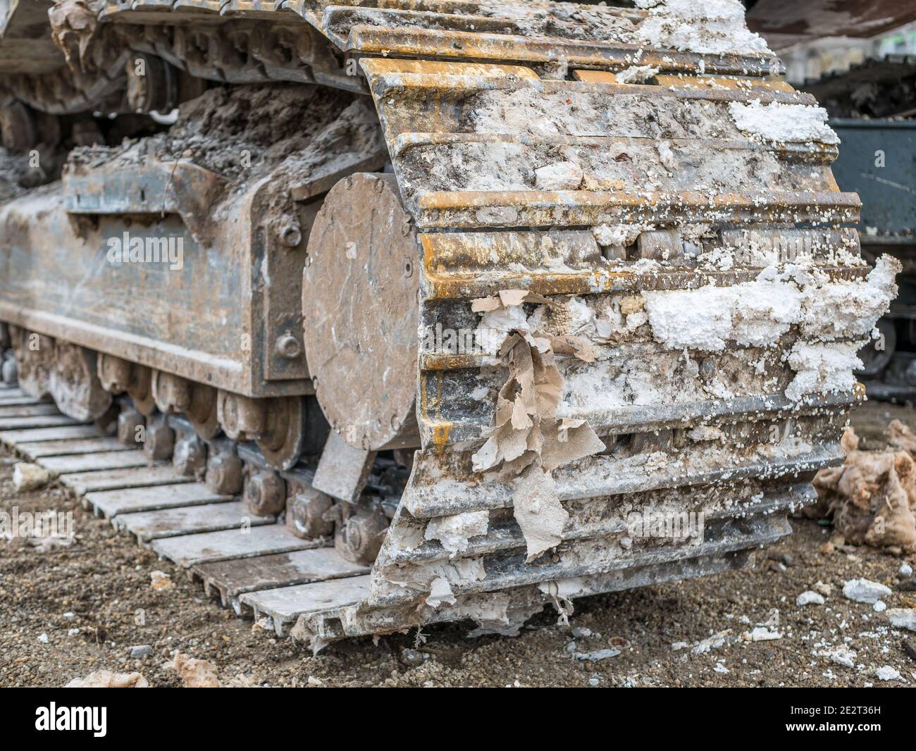 Close up detail with chain tracks of a bulldozer on a demolition site ...