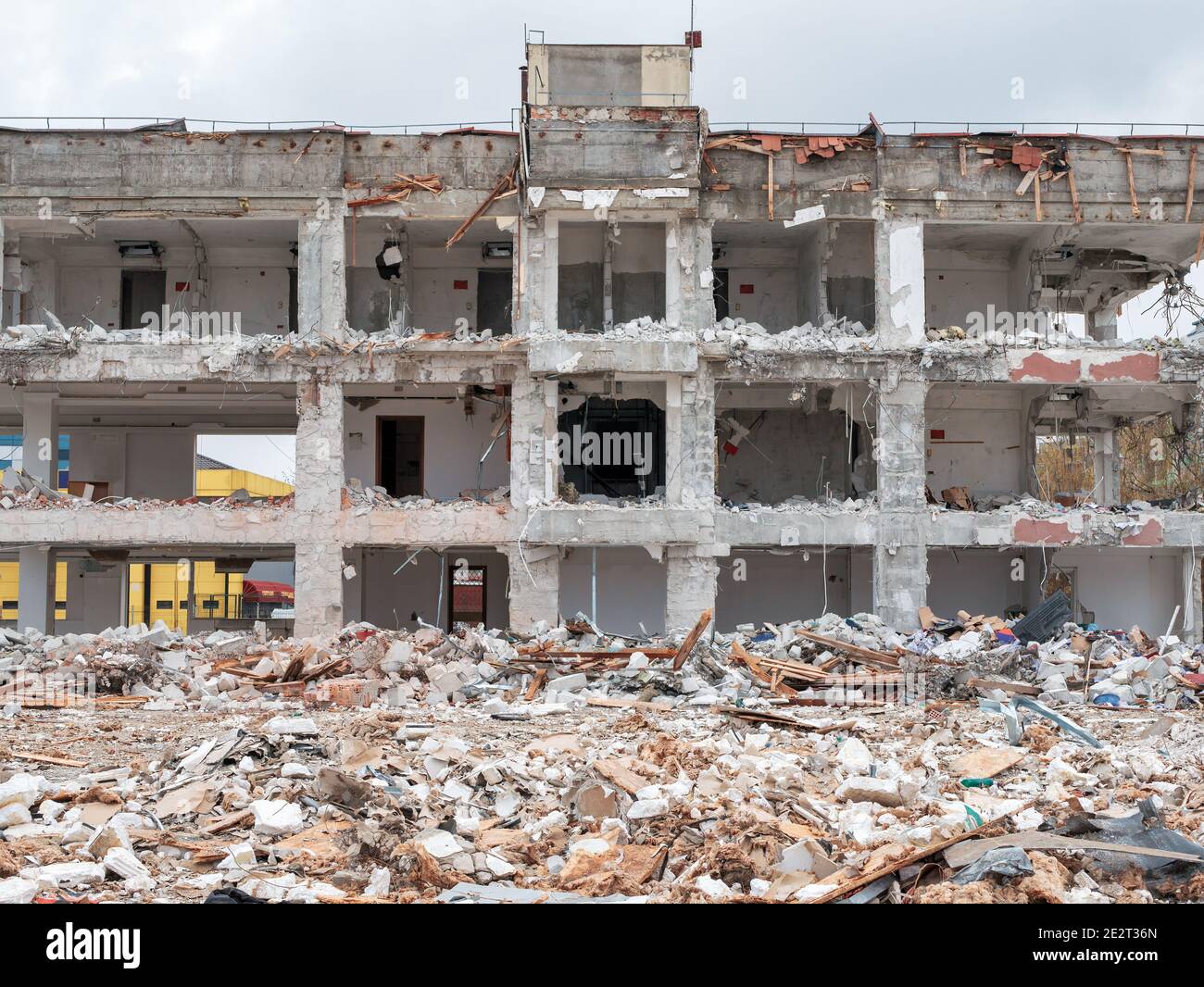 Building being demolished in Bucharest, Romania. Concrete remains and ...