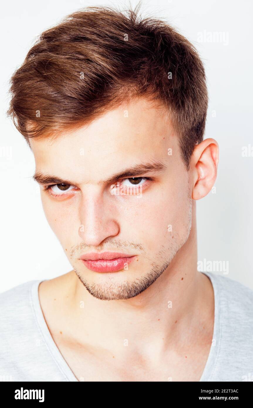 young handsome teenage hipster guy posing emotional, happy smiling ...