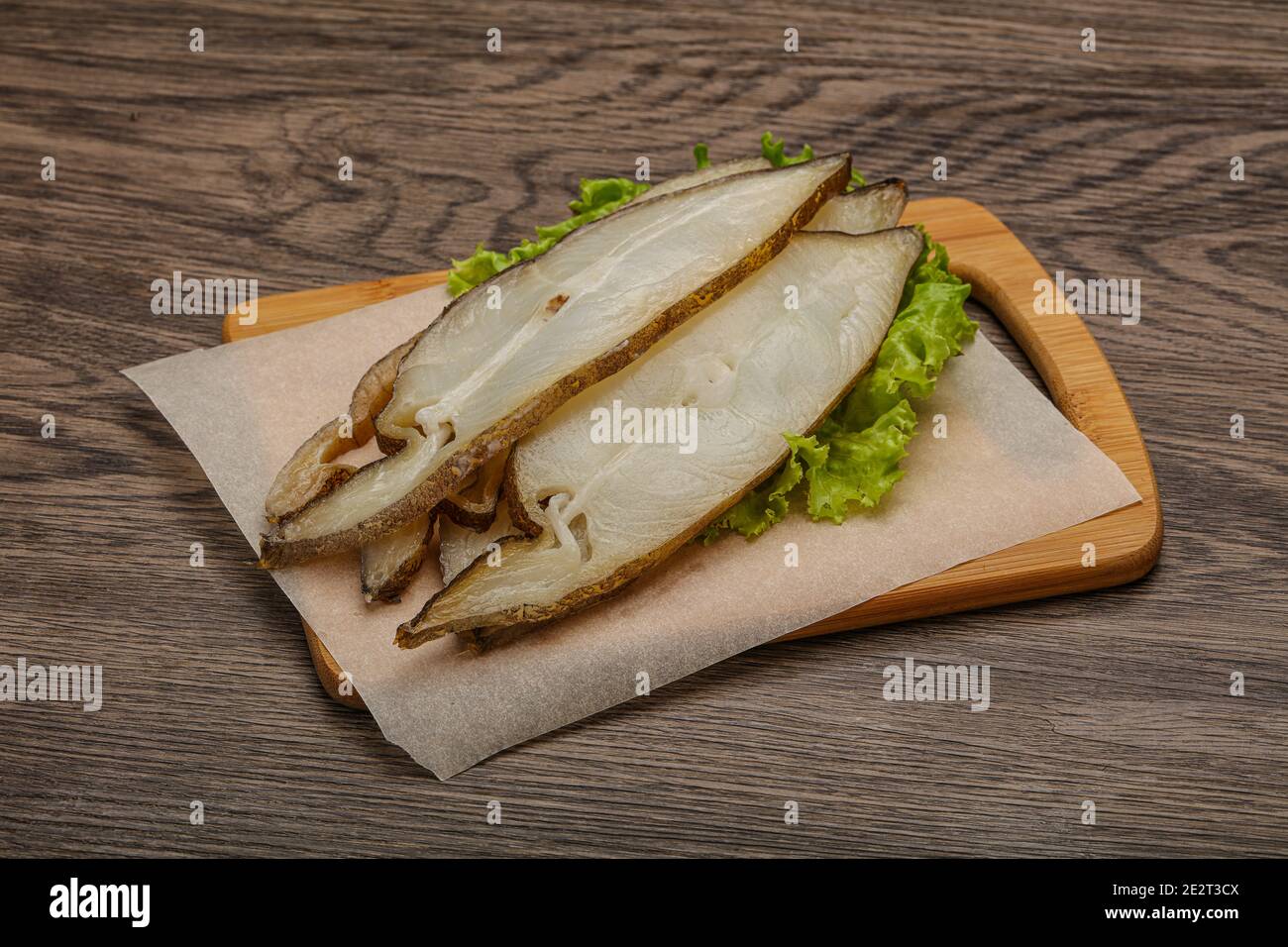 Delicous smoked halibut fish slices snack Stock Photo - Alamy