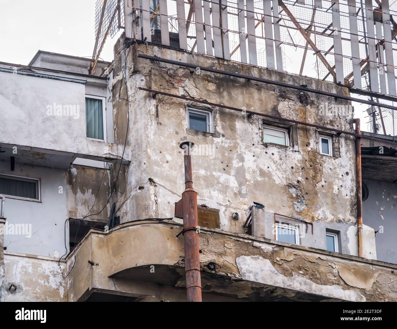 Old communist building with bullet marks or holes from the Romanian ...