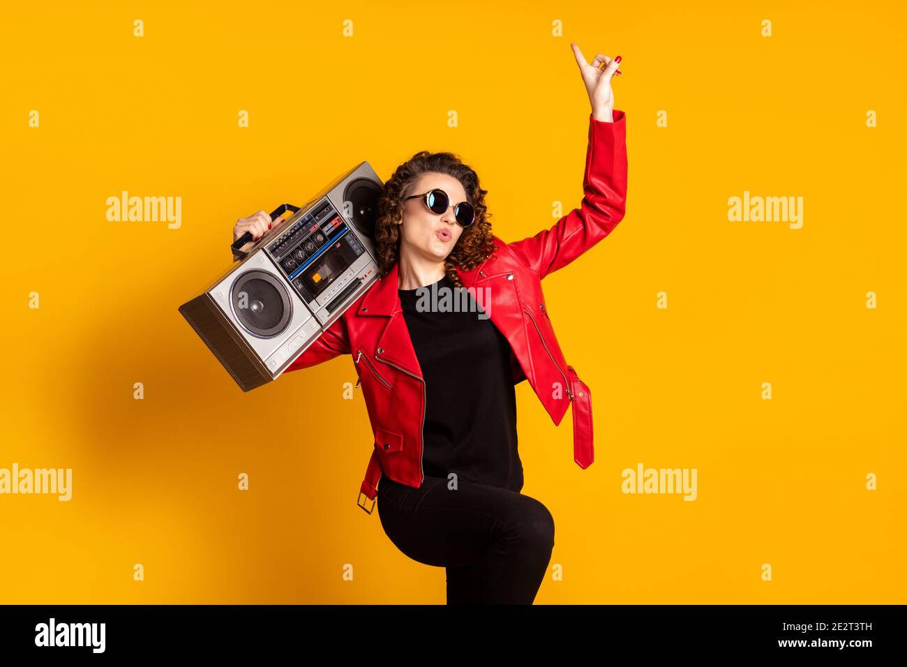 Photo of youth girl hold boom box dance wear jacket black pants ...