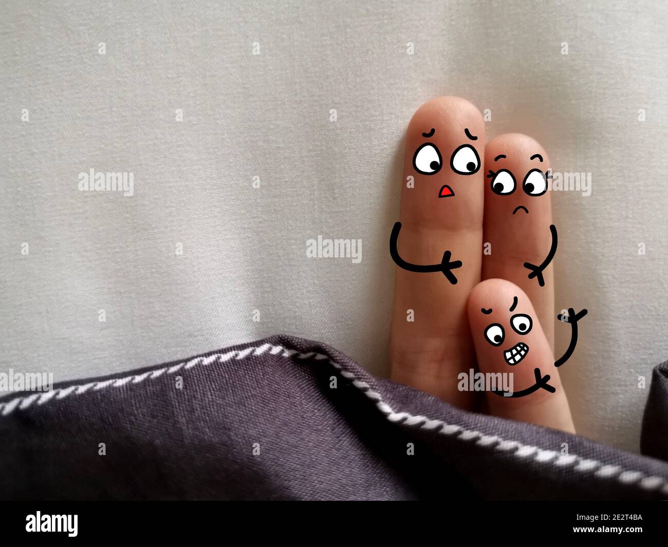 Three fingers are decorated as parents and a young child. The parents ...