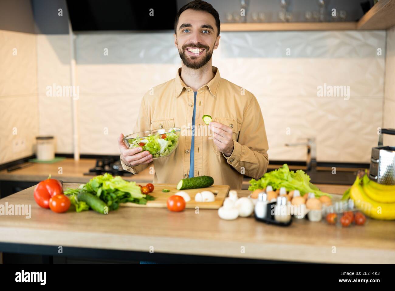 Handsome guy with beard and nice smile looks happy about healthy ...