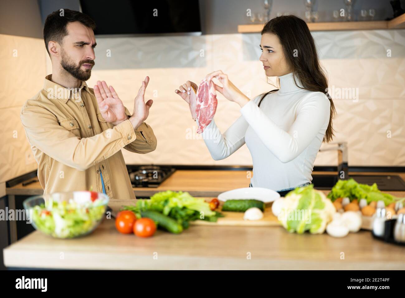 Vegetarian woman and man meat hi-res stock photography and images - Alamy