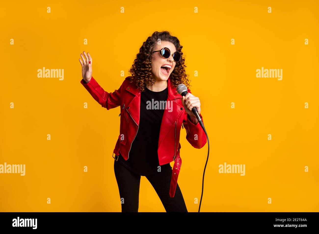 Woman Singing With Yellow Jacket High Resolution Stock Photography and ...