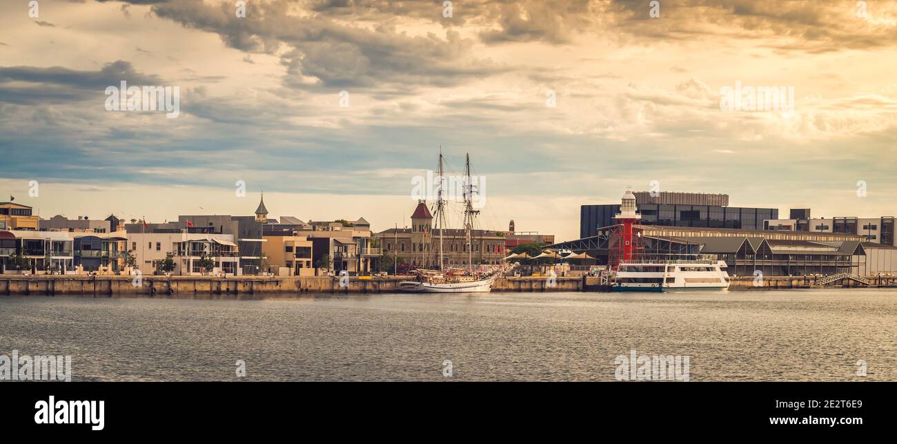 Iconic Port Adelaide lighthouse with tourist boat viewed across Port ...