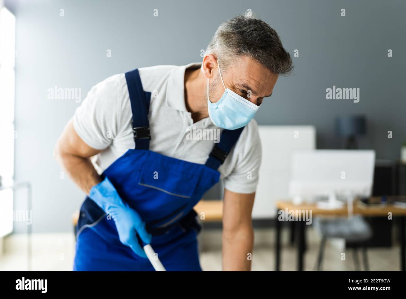 Male janitor in mask hi-res stock photography and images - Alamy