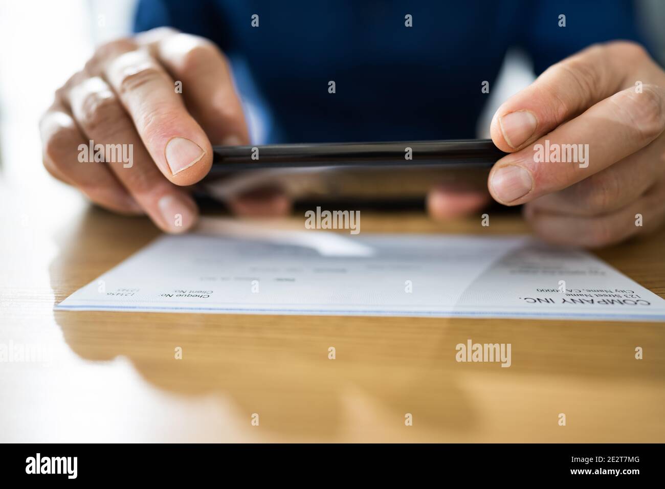 Remote Check Deposit Taking Photo With Mobile Phone Stock Photo - Alamy