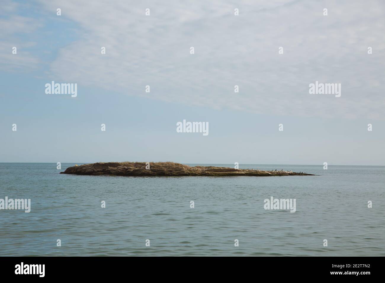 Caspian Sea clouds and a small island. blue sky by the sea Stock Photo ...