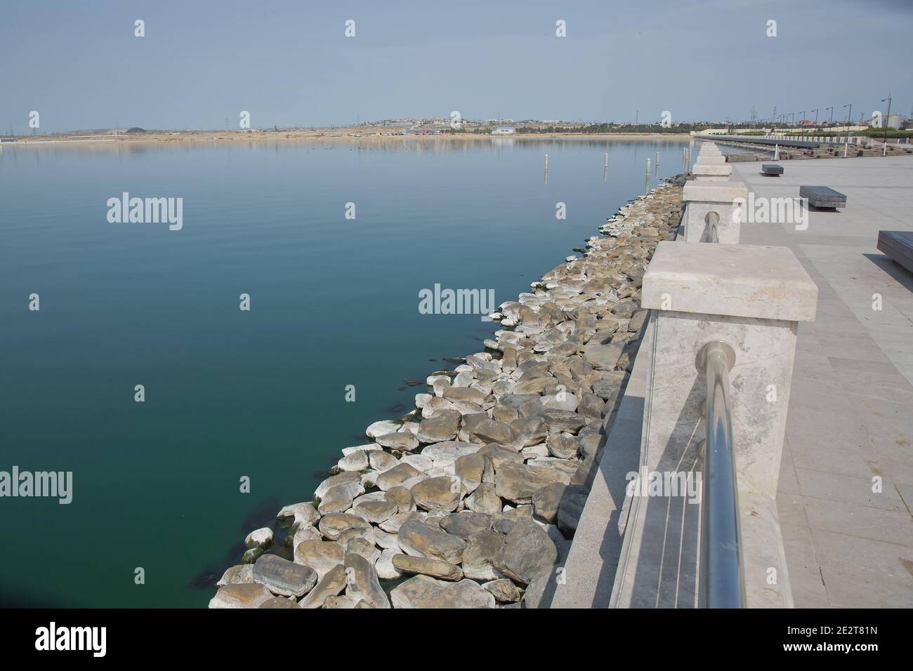 An oval bridge from iron and wood on the edge of the lake . Boyukshor ...