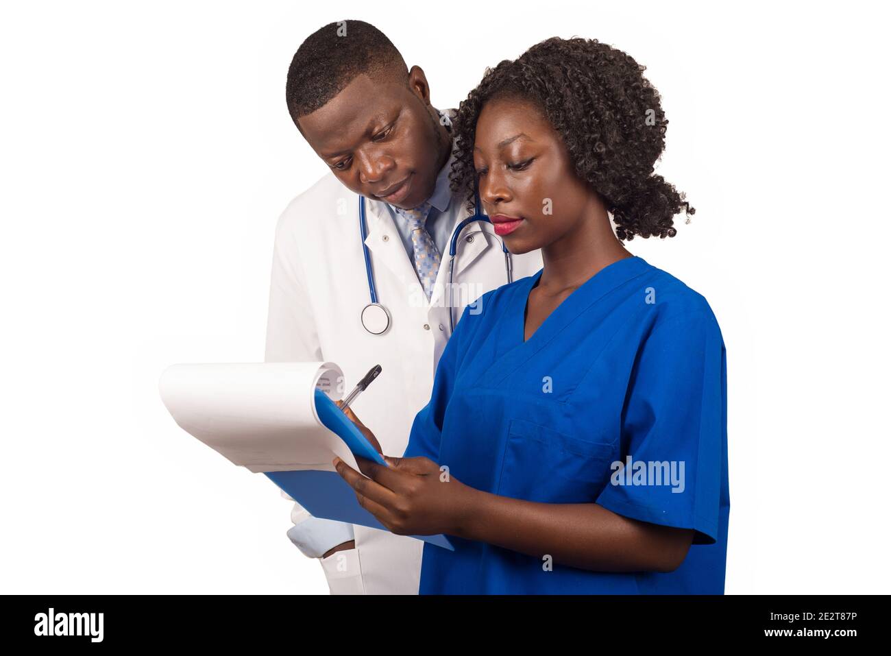 doctor and trainee standing to establish medical file of a patient in ...