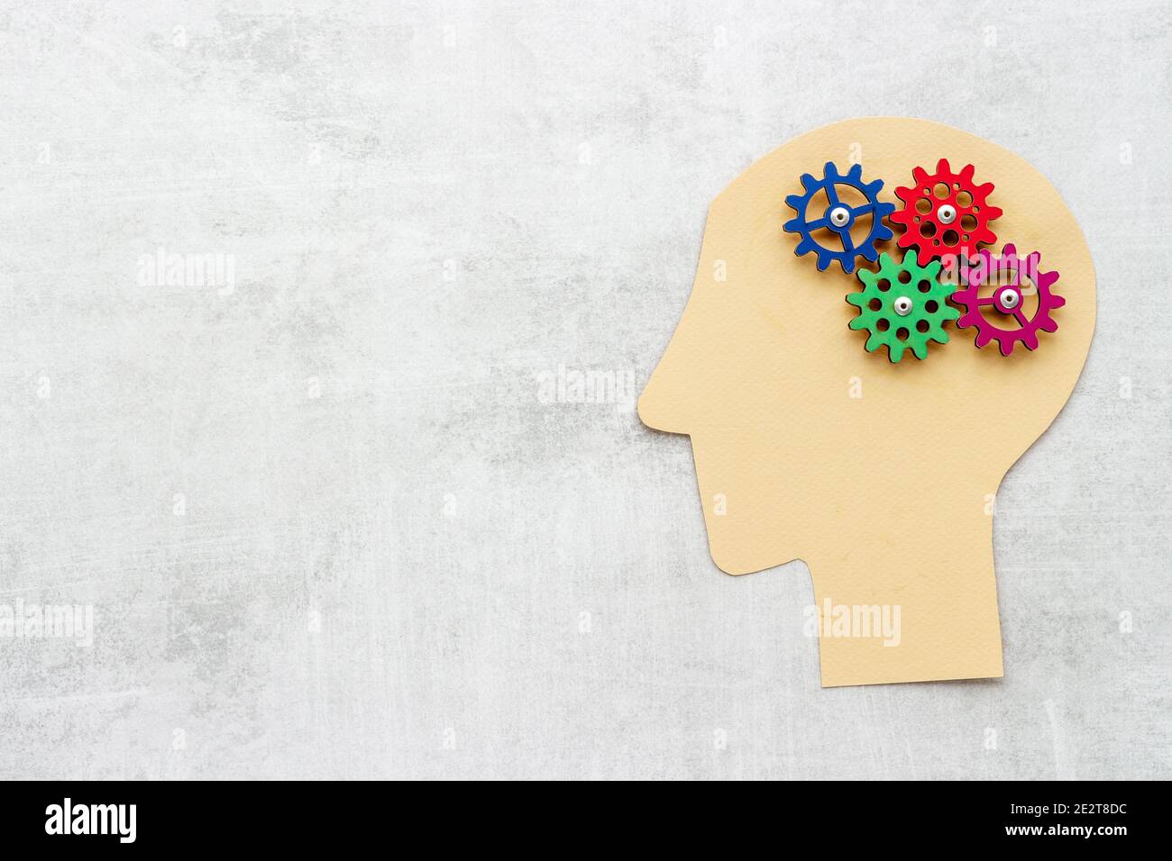 Paper head with brain of gears and cogs. Mental works concept Stock ...
