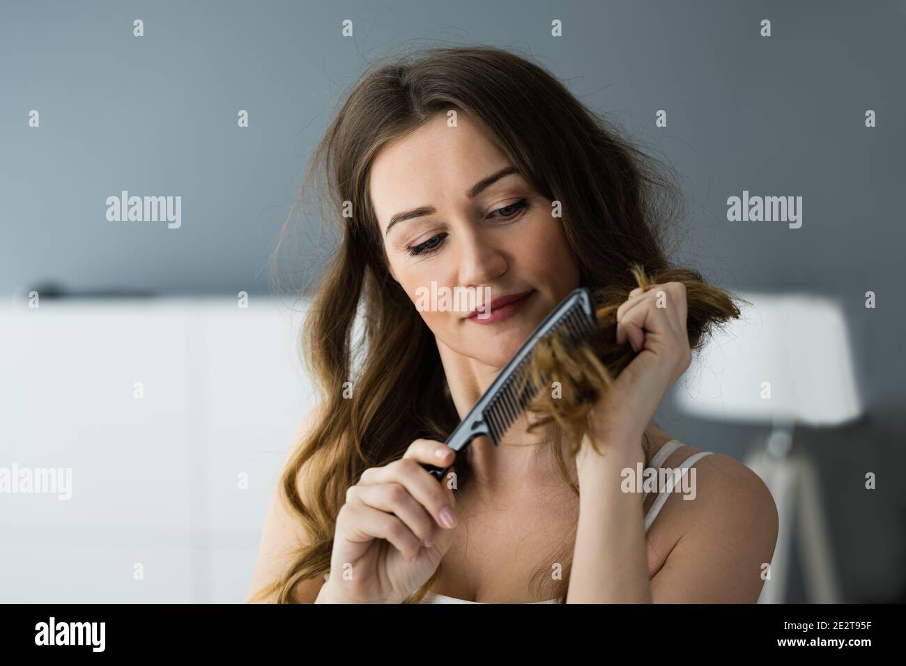 Woman young very long hair combing hi-res stock photography and images ...
