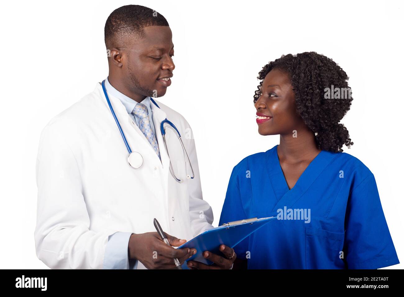 young trainee standing in uniform looking at doctor show him work ...