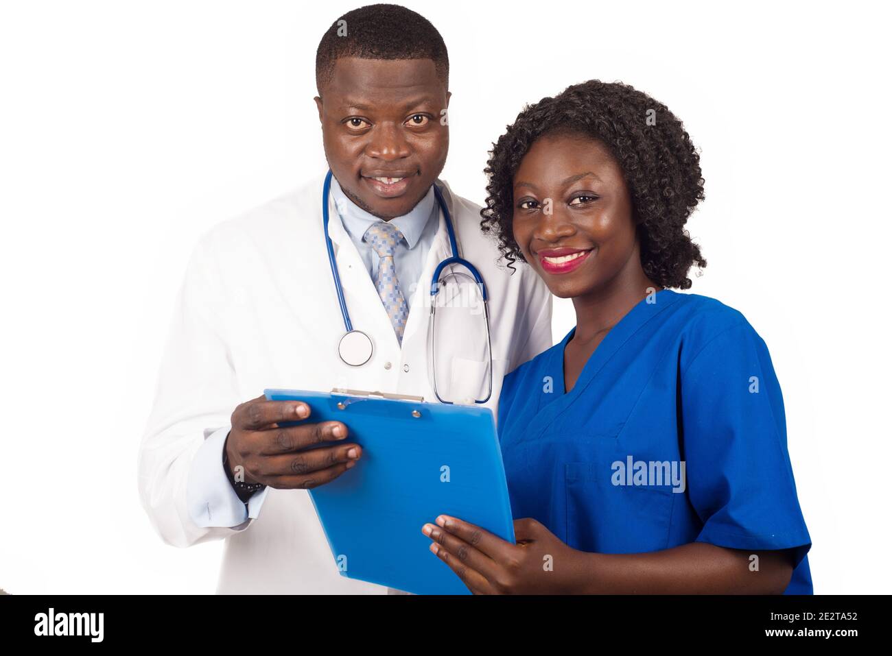 doctor and trainee standing in uniform looking at the camera smiling ...