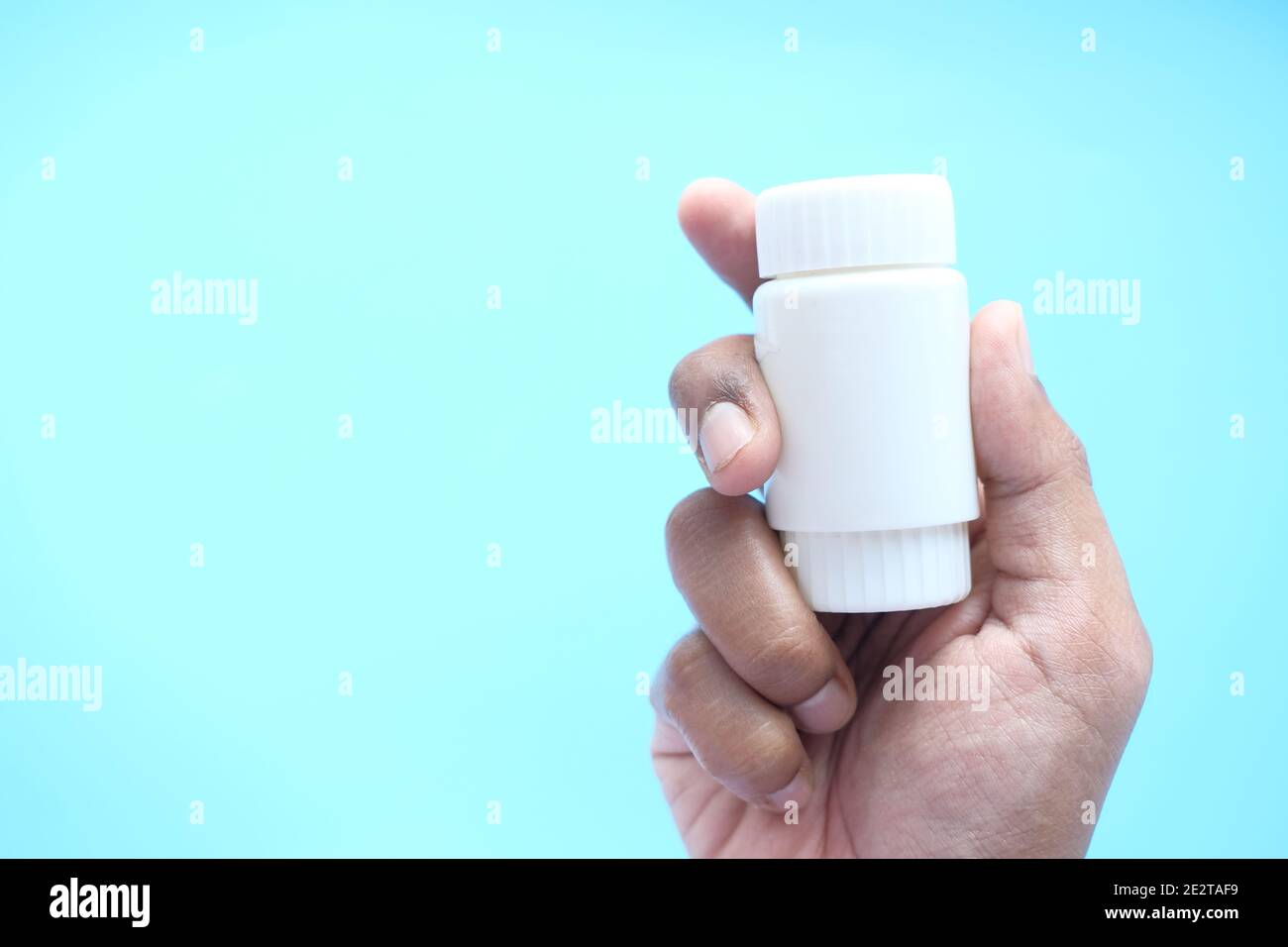 person hand holding pill container Stock Photo - Alamy