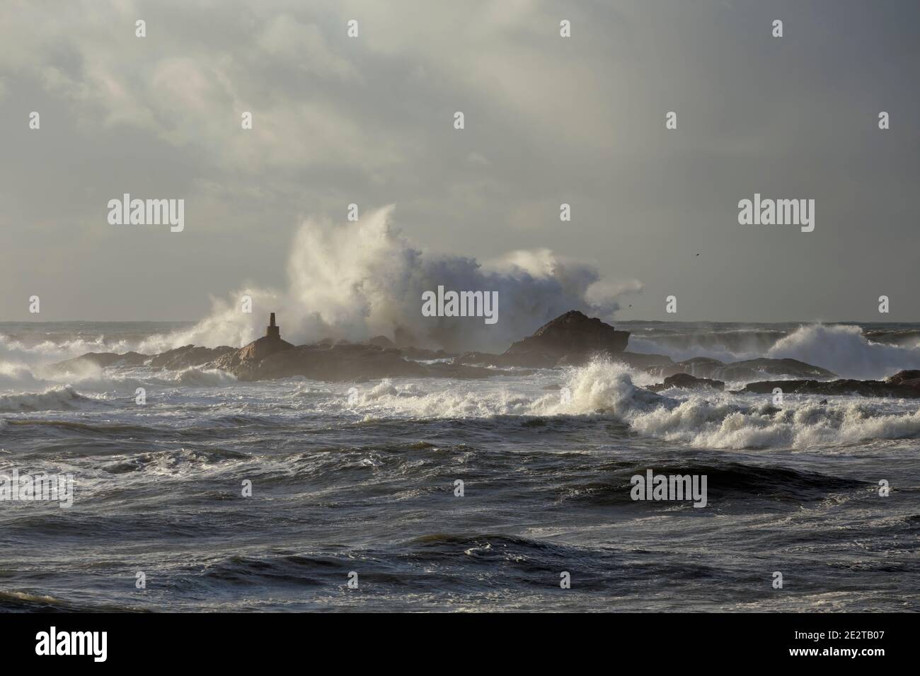 Storm on the coast seeig big wave breaking over rocks and cliffs seeing ...