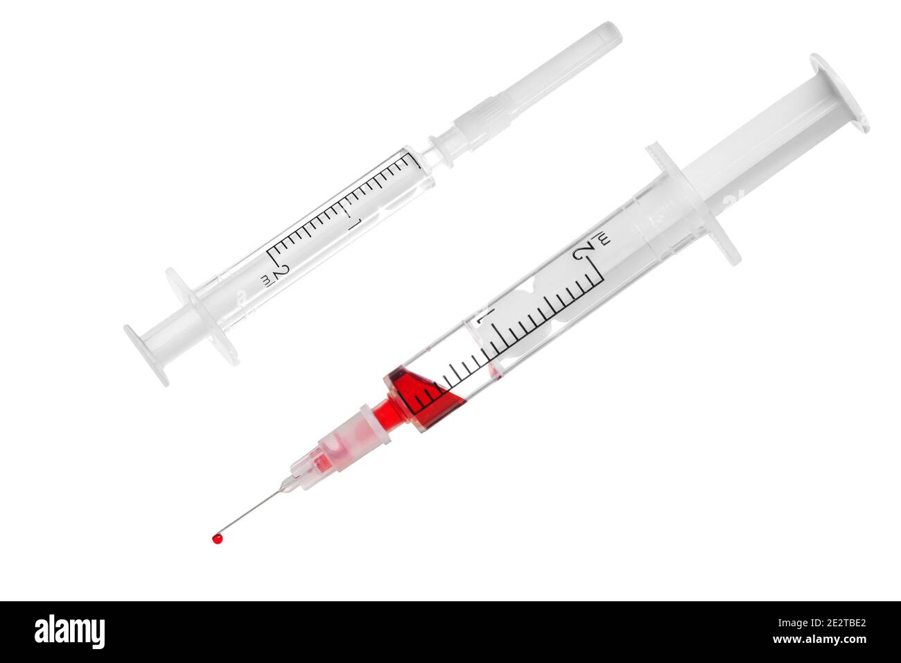 Syringe with red liquid and a drop of blood on a needle Stock Photo - Alamy
