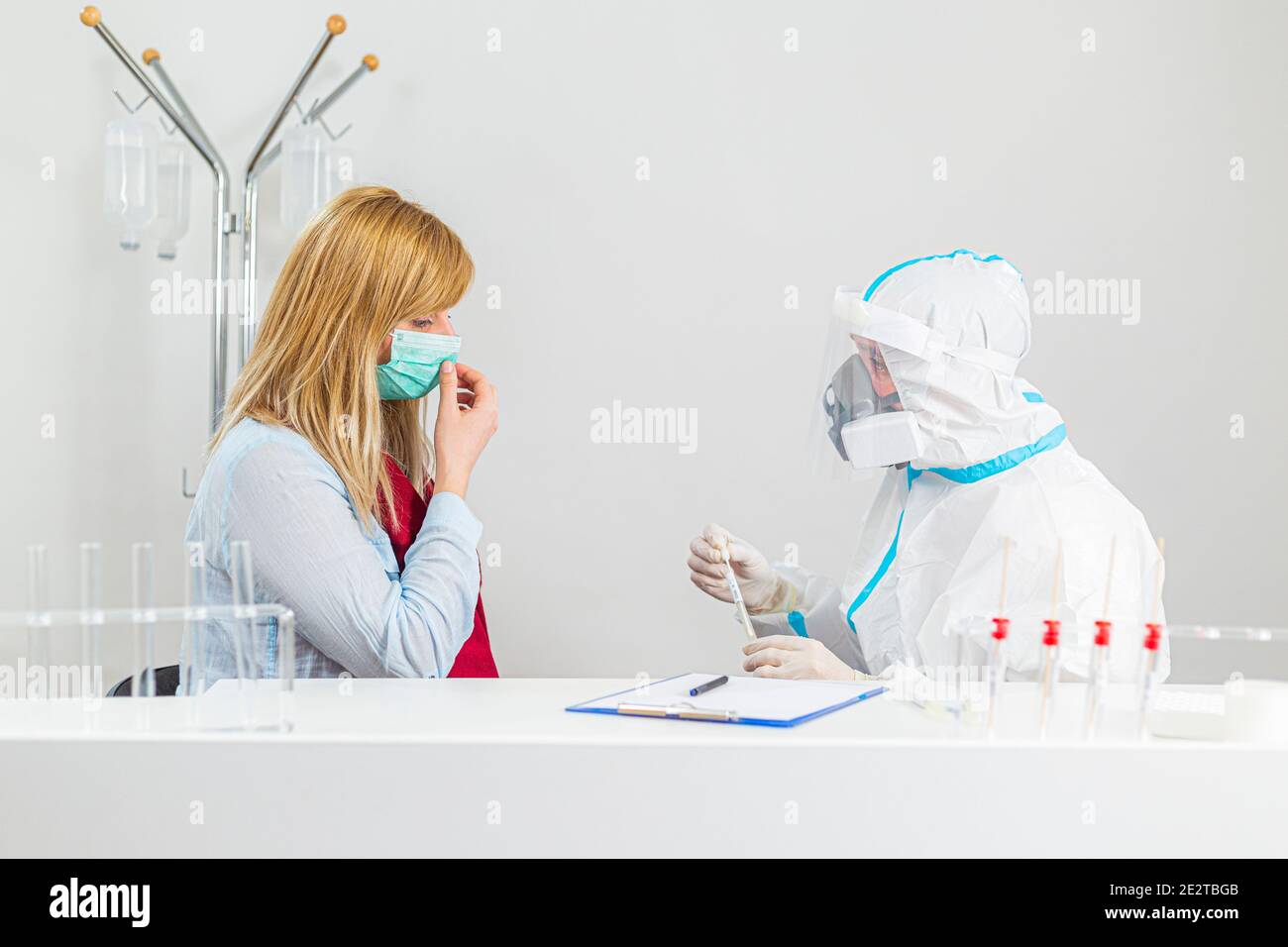 Medical worker performing COVID-19 test, taking nasal swab sample from ...