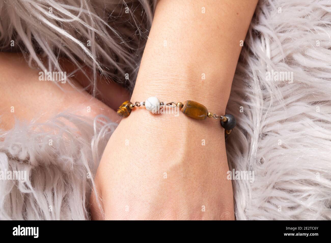Wearing bracelet stones hi-res stock photography and images - Alamy