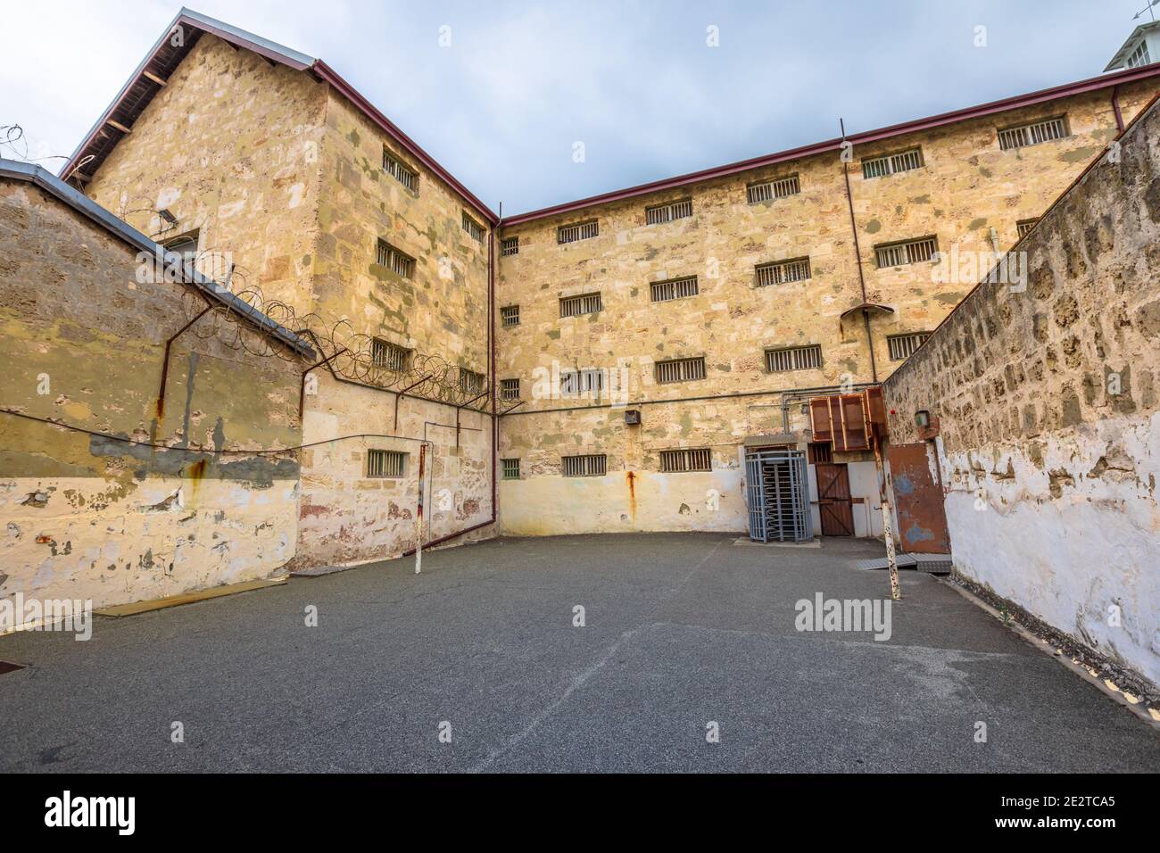 courtyard with barbed wire of Fremantle Prison historic building ...