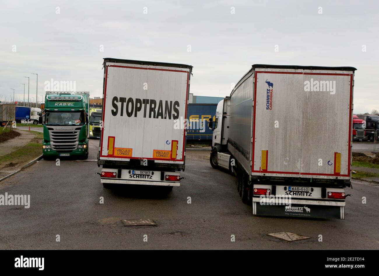 Lorry drivers manoeuvre their trucks as they park before using a ...