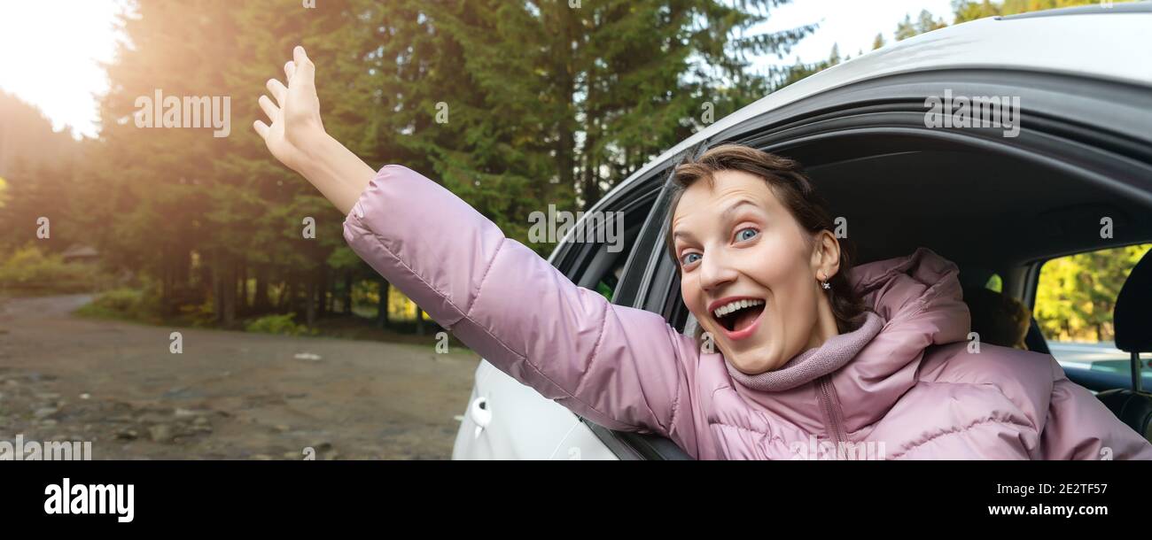 Portrait of young adult beautiful caucasian woman driver enjoy roadtrip ...
